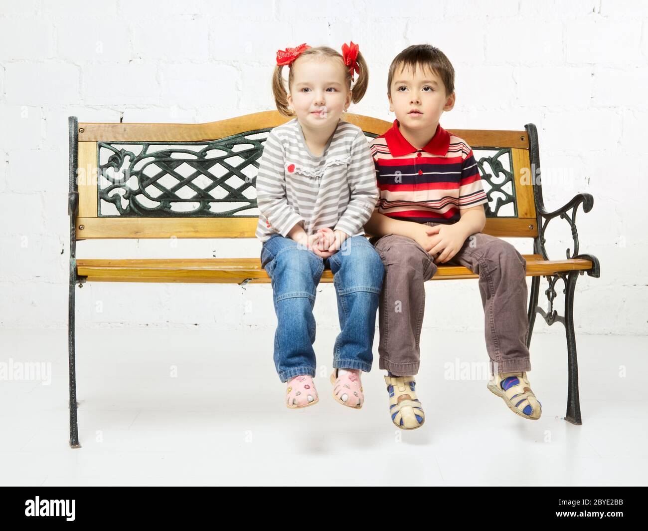 Children on Bench Stock Photo - Alamy