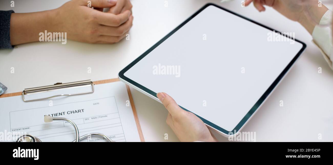 Close up view of doctor diagnose patient with mock-up tablet, patient ...