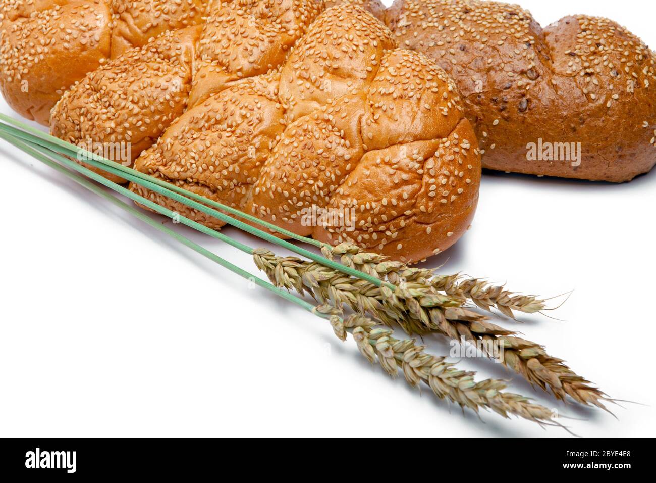 Wheat and bread on white background Stock Photo - Alamy