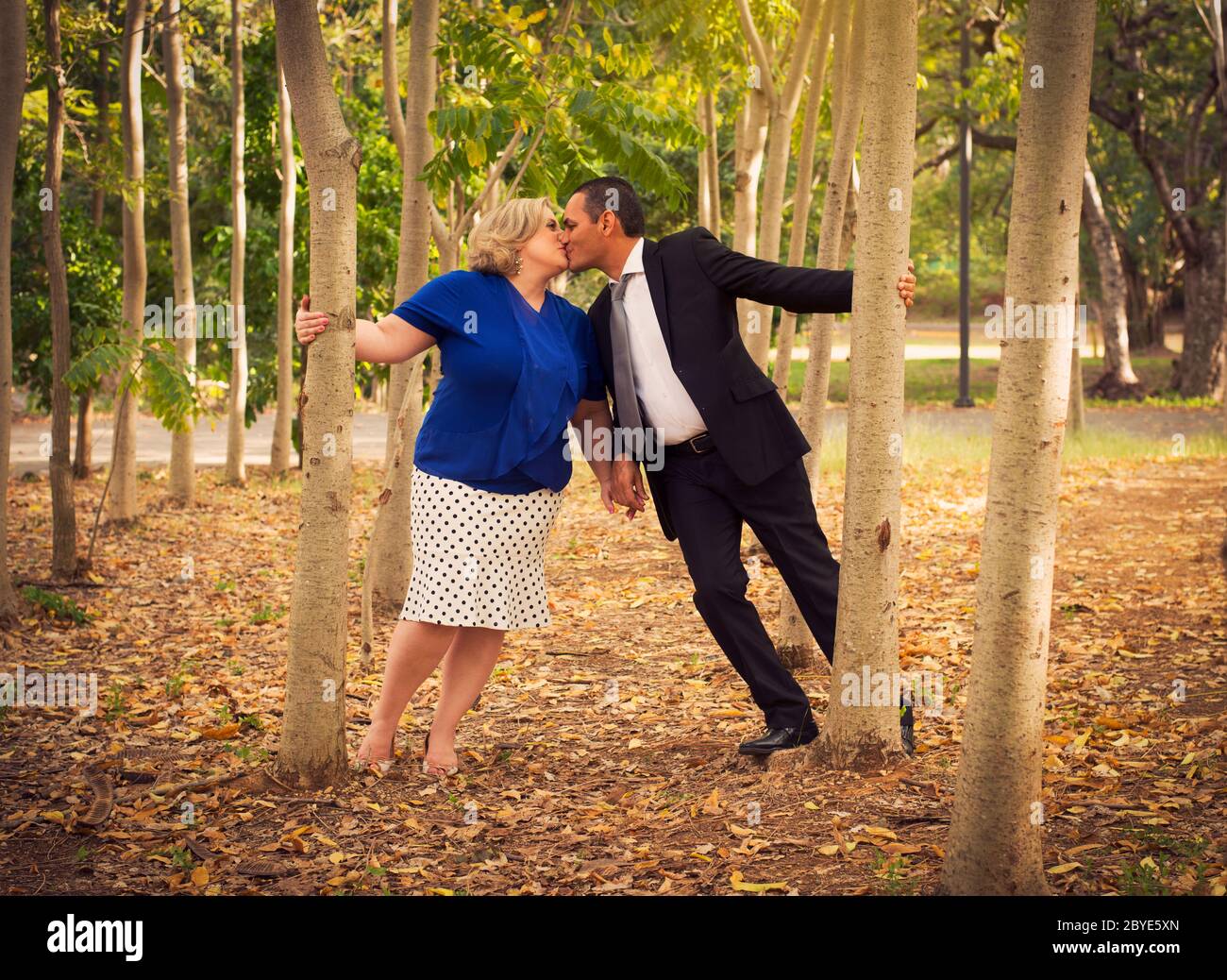 Romantic young couple hugging kissing hi-res stock photography and images - Alamy