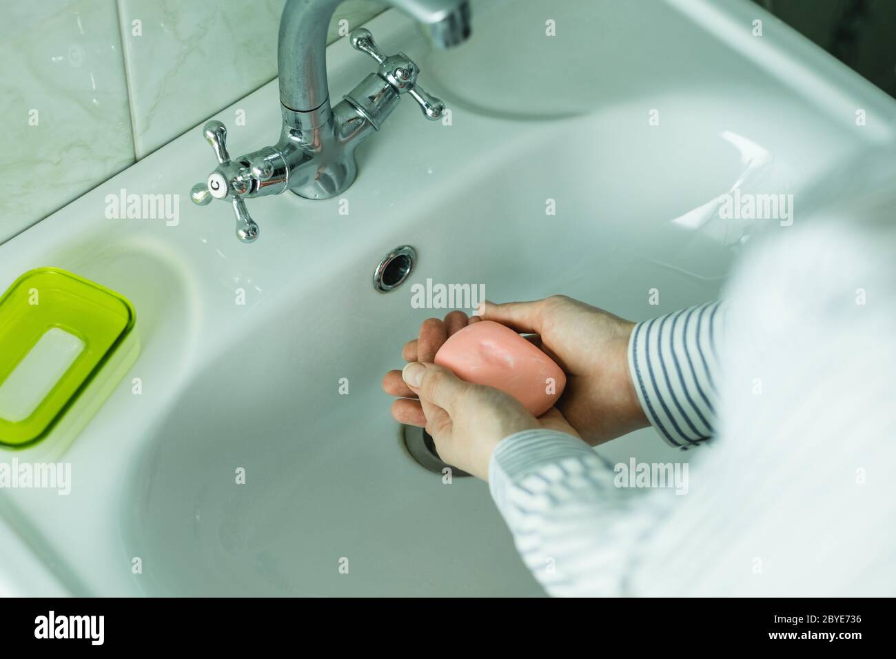 Cleaning hands with soap and water Stock Photo - Alamy