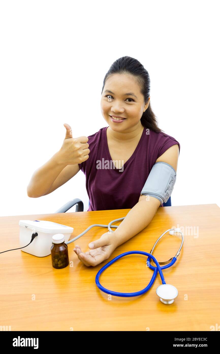 Woman with blood pressure test Stock Photo - Alamy