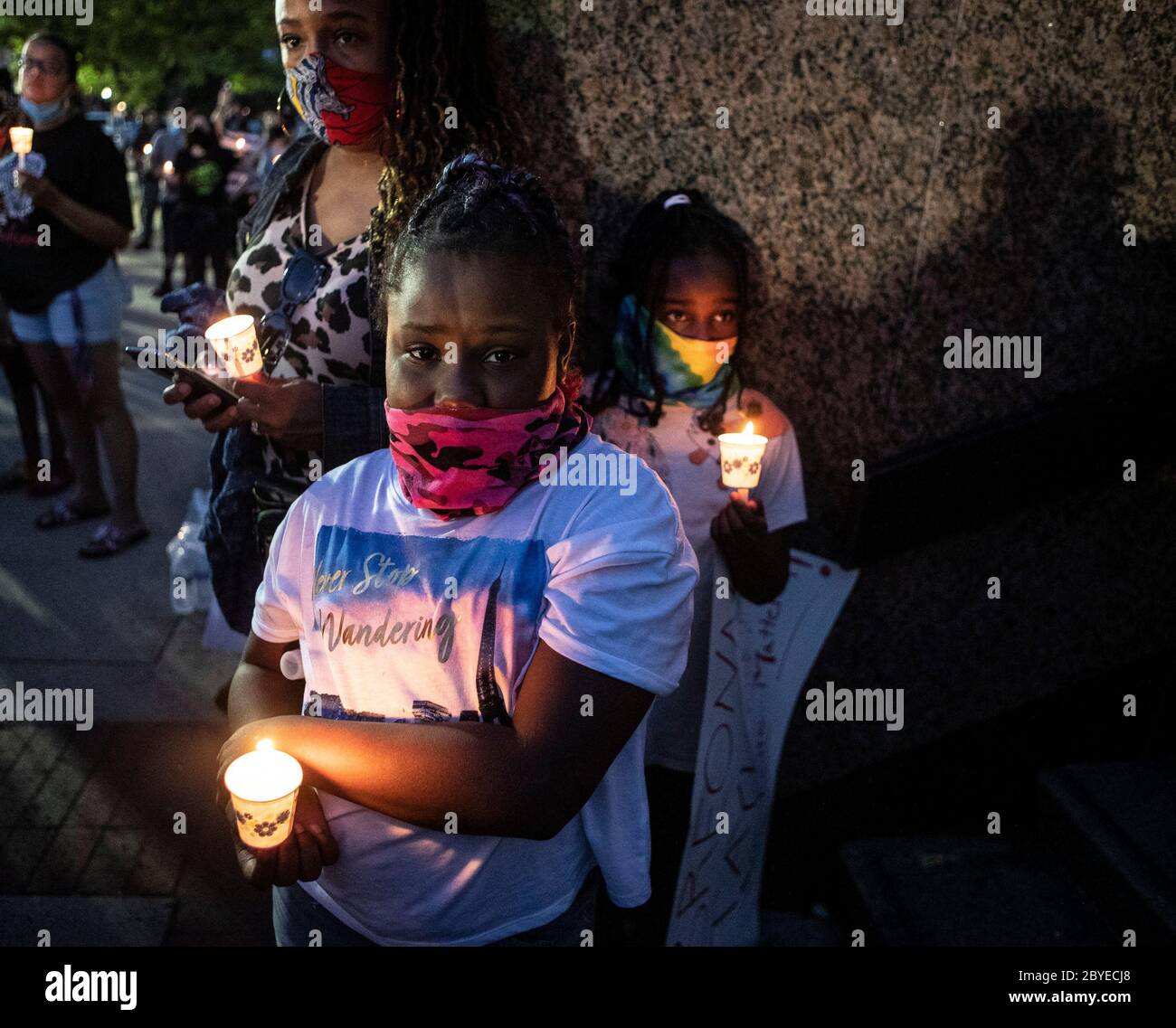 Rahway, New Jersey, USA. 9th June, 2020. A mother and her children hold ...