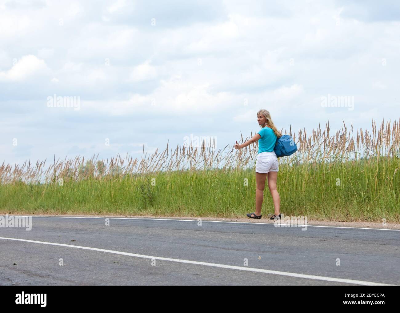 Girl hitchhiking hi-res stock photography and images - Alamy