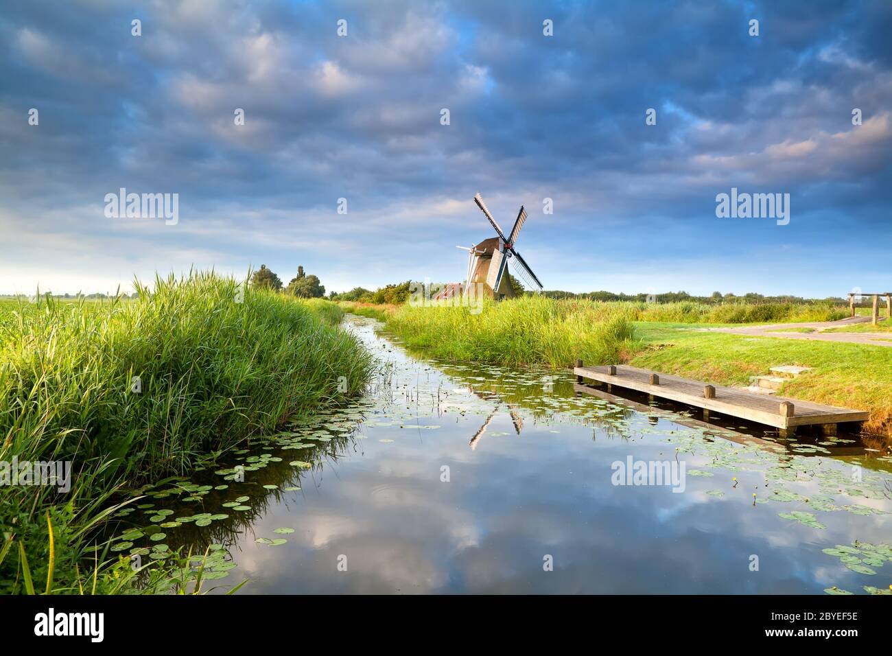 Dutch windmill and blue morning sky Stock Photo - Alamy