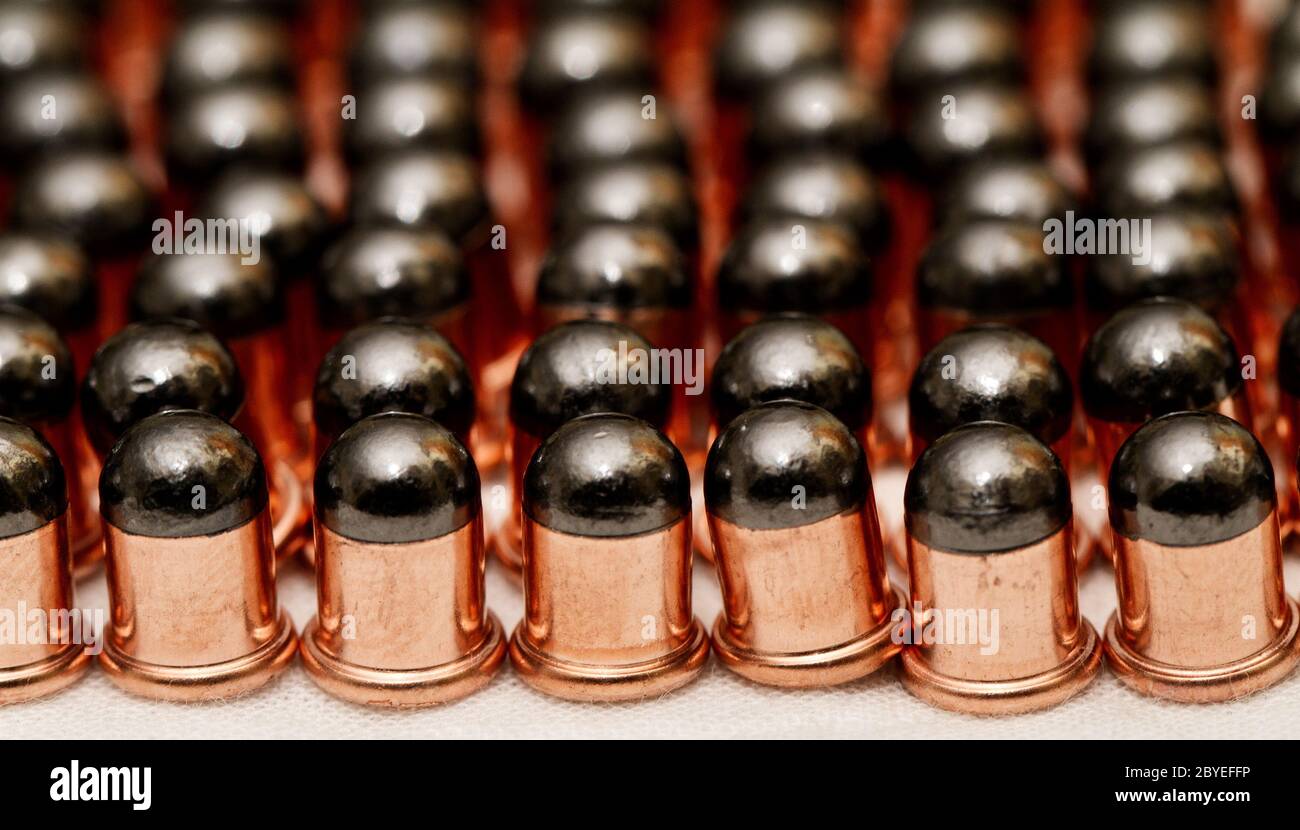Gun bullets over white background Stock Photo - Alamy