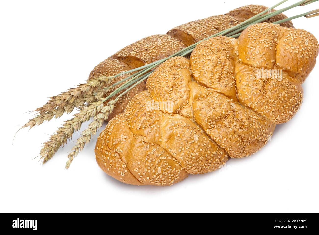 Wheat and bread on white background Stock Photo - Alamy