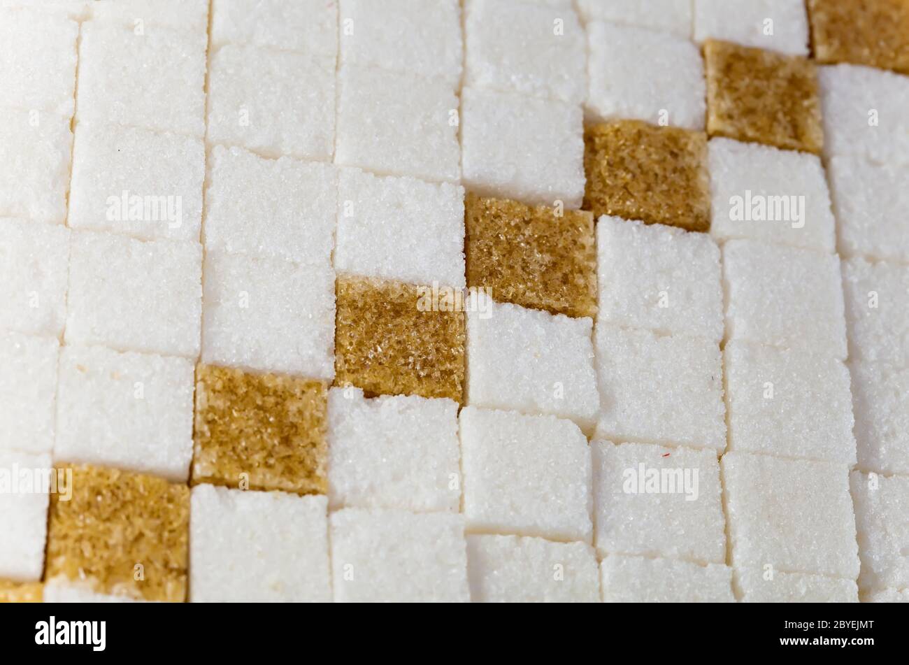 Cubes of not refined reed sugar and white sugar Stock Photo - Alamy