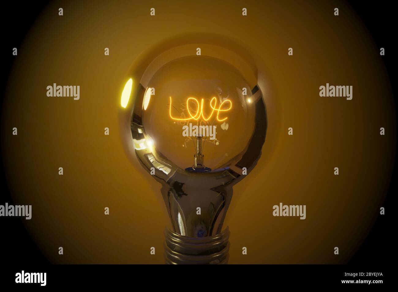3D rendering background , Close up view, wording " love " glowing light ...