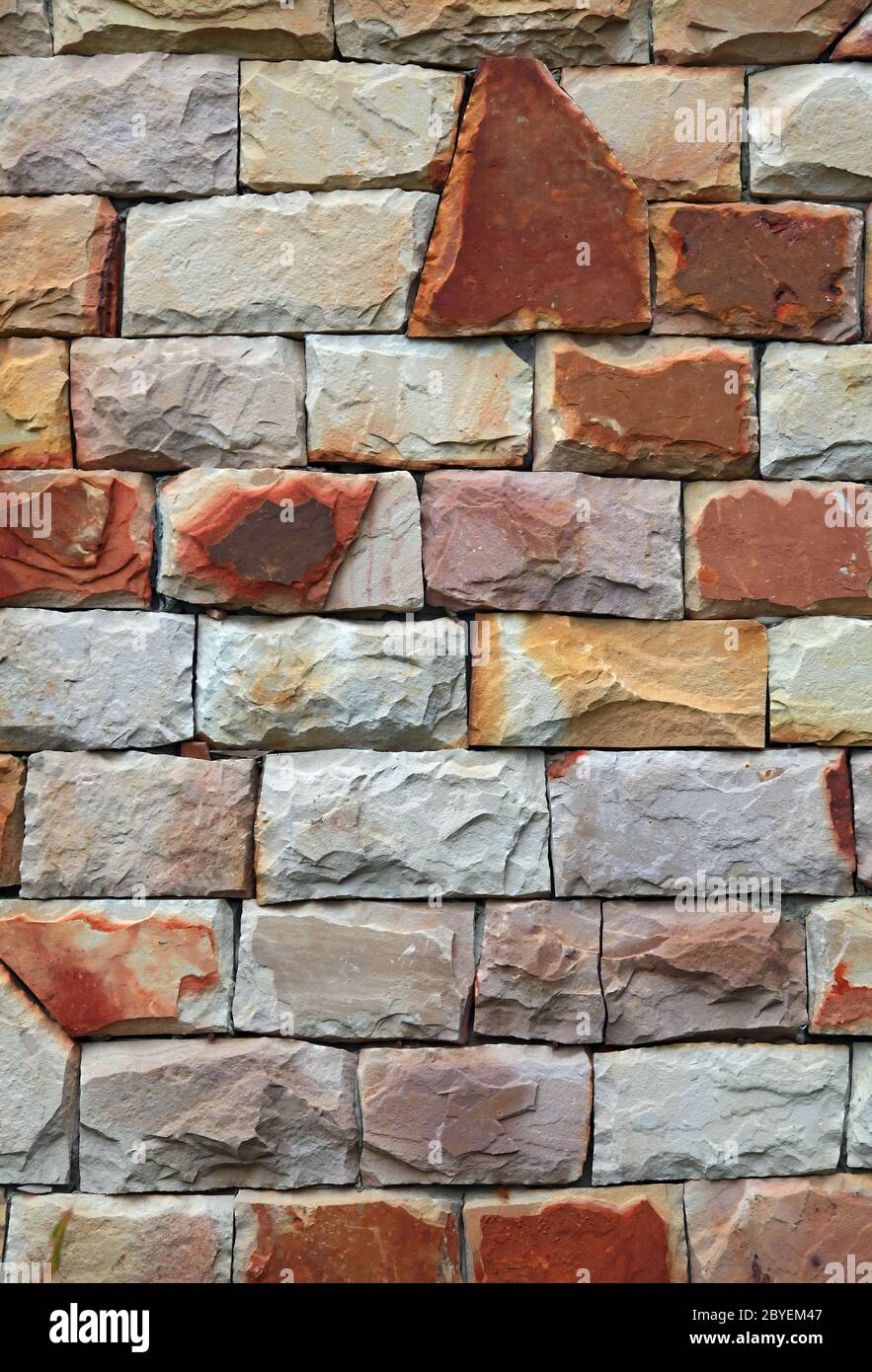 modern irregular shapes of red stone brick wall background Stock Photo ...