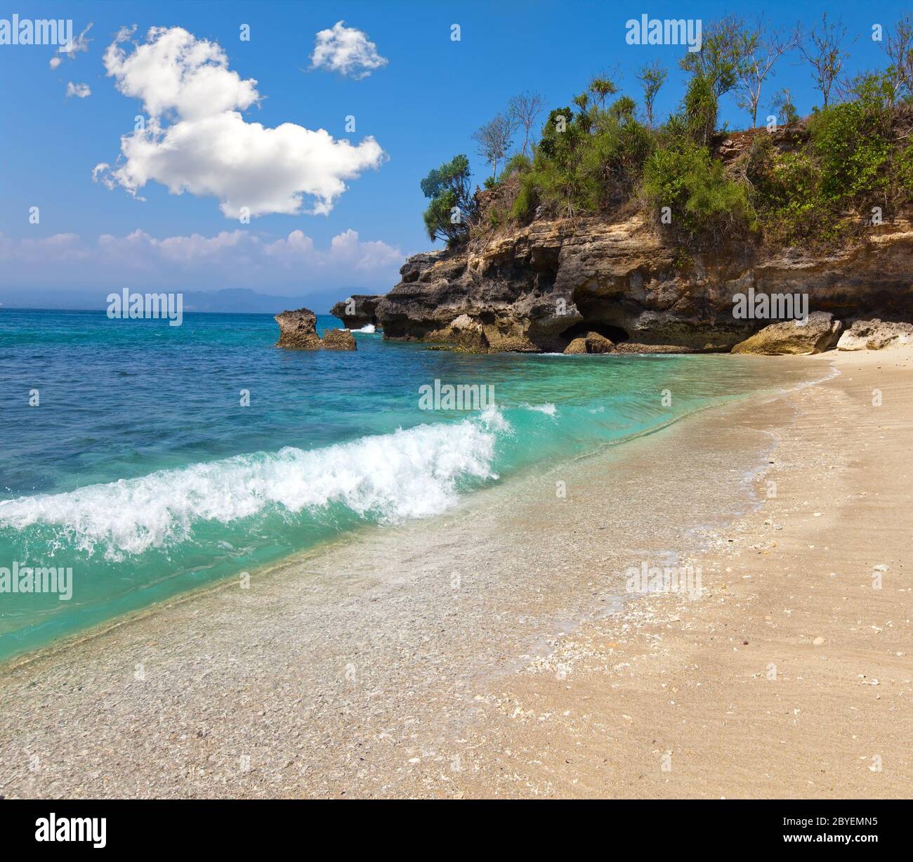sandy beach on rocks at ocean. Indonesia, Bali Stock Photo - Alamy
