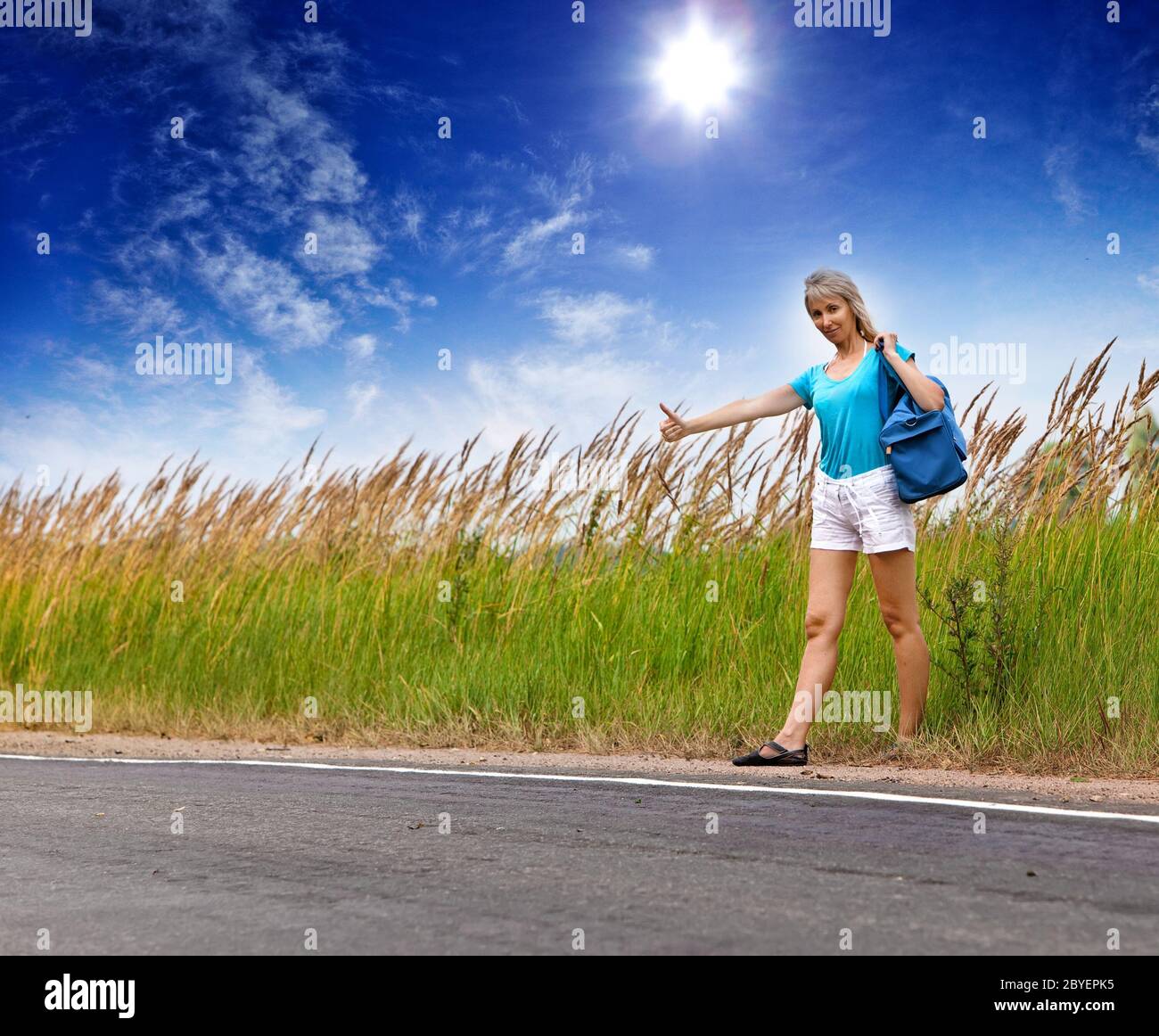 Girl hitchhiking hi-res stock photography and images - Alamy