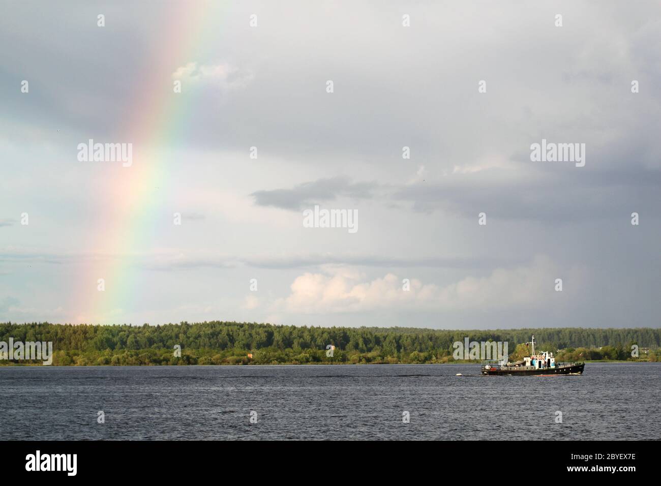 Multi-colored rainbow in the sky Stock Photo - Alamy