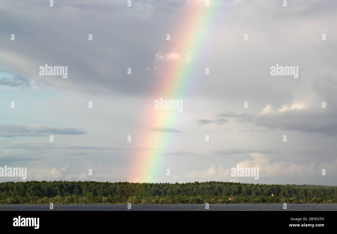 Multi-colored rainbow in the sky Stock Photo - Alamy