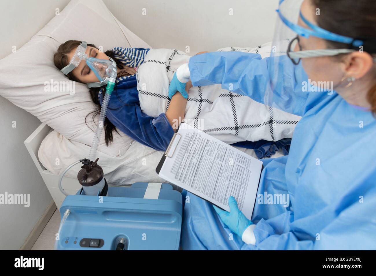 Checks blood pulse. Infectious ward physician. A young teenager is ...
