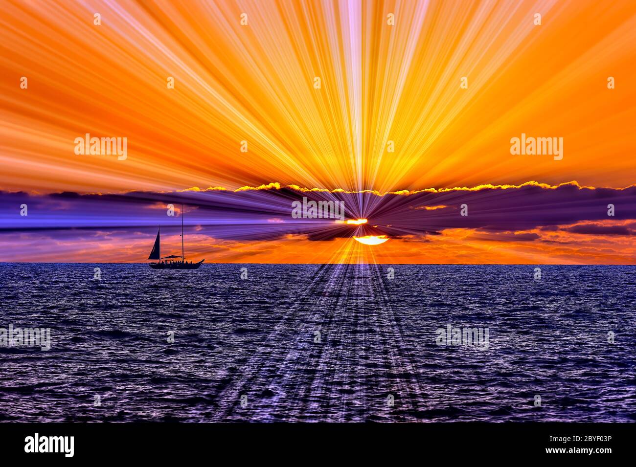 A Beautiful Sunset With a Boat Sailing along the Ocean Water and Sun ...