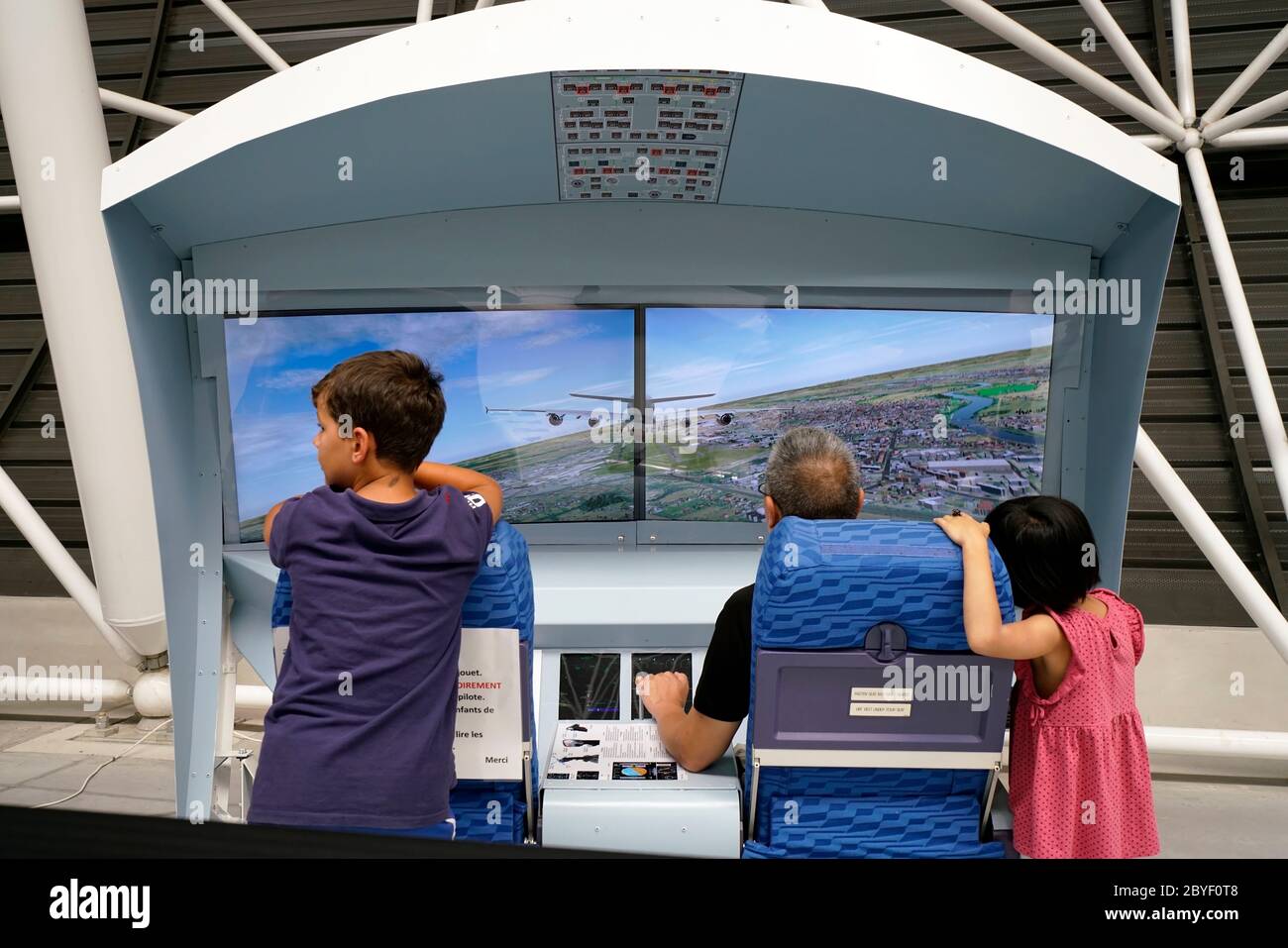 A visitor on flight simulator in Musee Aeroscopia Museum.Blagnac ...