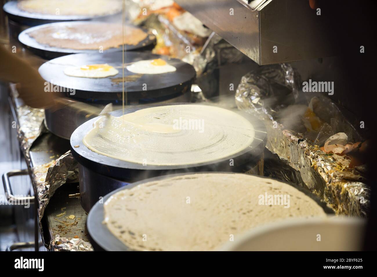 French chef cooking traditional galette in Rennes ,France Stock Photo ...