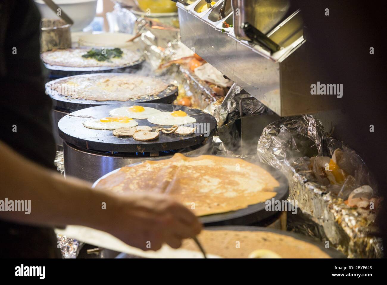 French chef cooking traditional galette in Rennes ,France Stock Photo ...