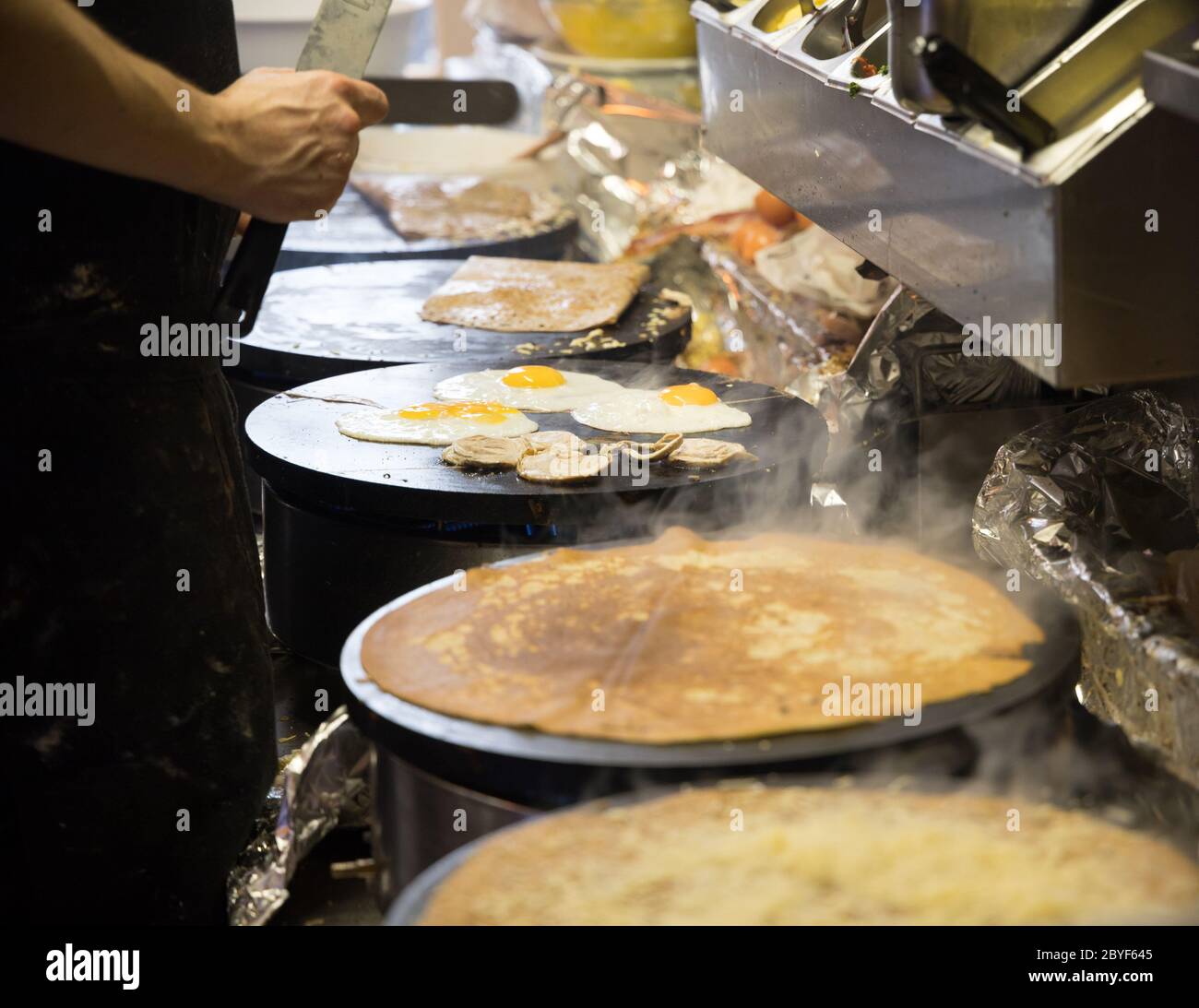 French chef cooking traditional galette in Rennes ,France Stock Photo ...