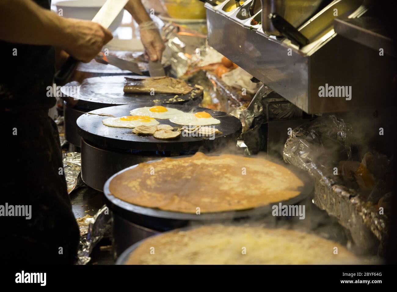 French chef cooking traditional galette in Rennes ,France Stock Photo ...