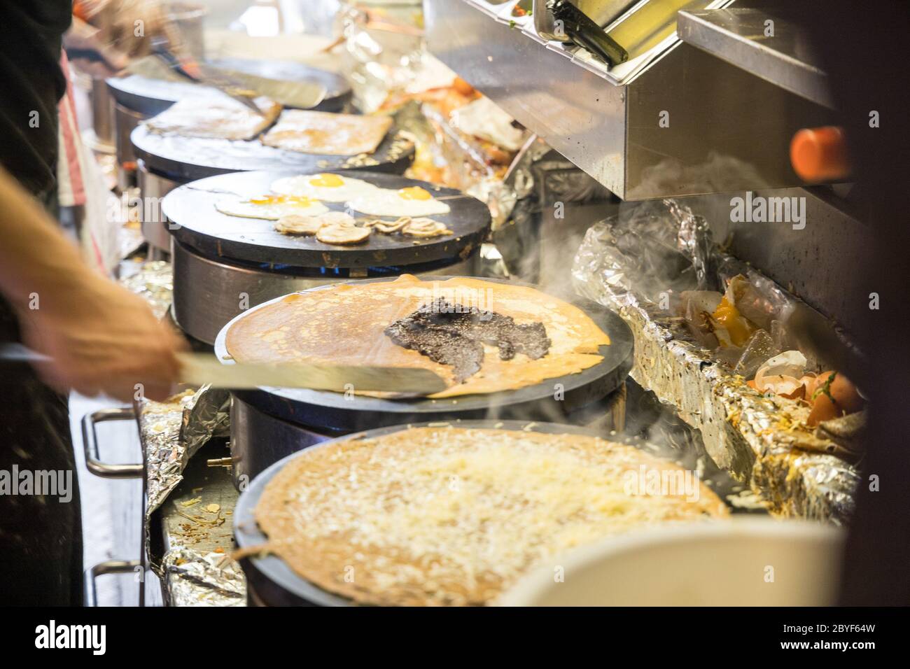French chef cooking traditional galette in Rennes ,France Stock Photo ...
