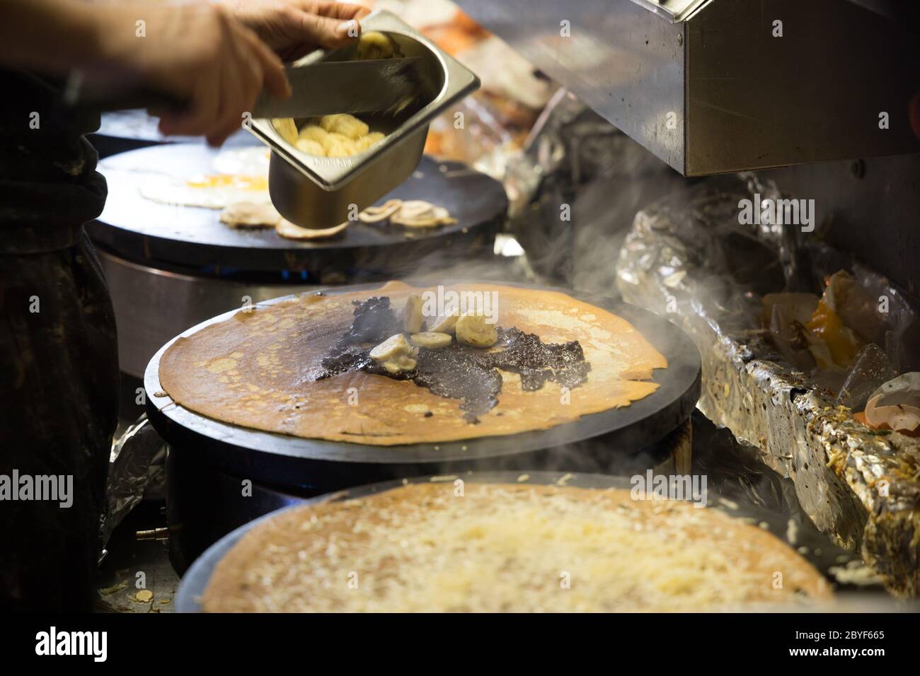 French chef cooking traditional galette in Rennes ,France Stock Photo ...