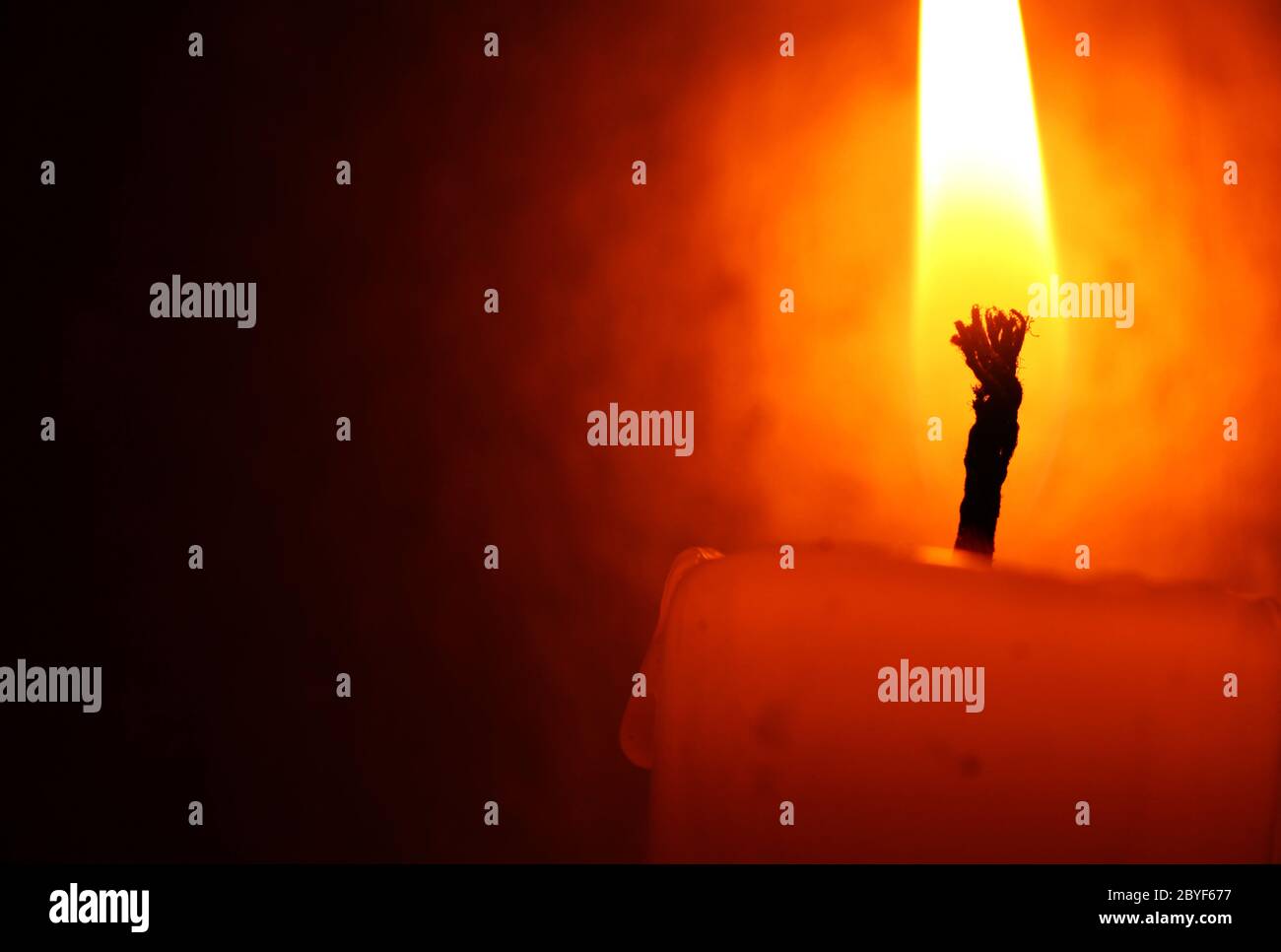 Ignited candle hi-res stock photography and images - Alamy