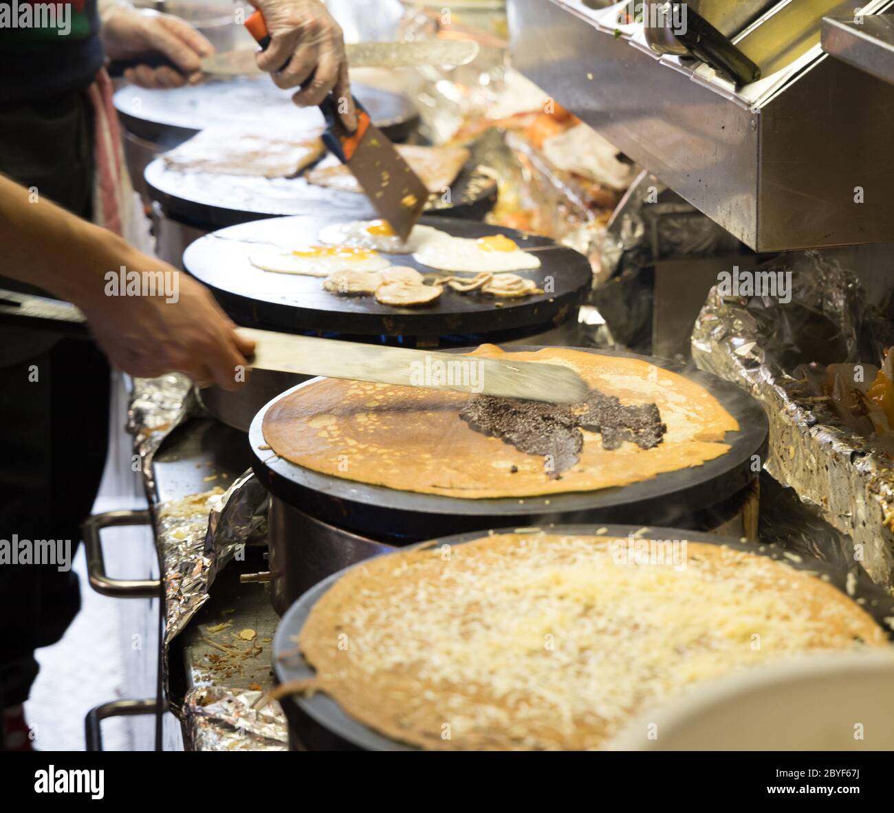 French chef cooking traditional galette in Rennes ,France Stock Photo ...