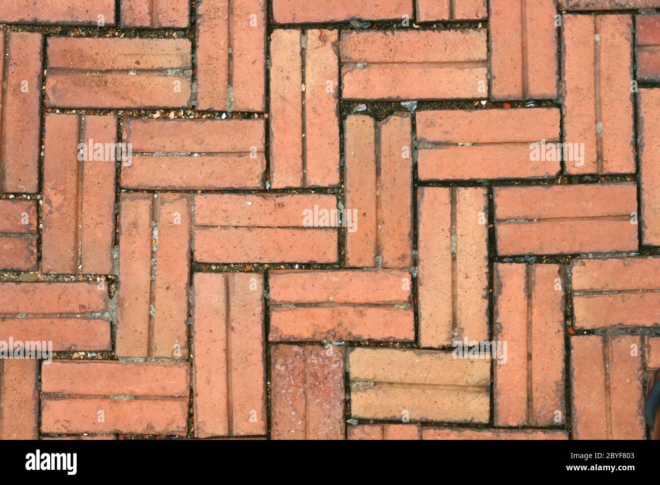 Pattern of Crossing Red Stone pavement Stock Photo - Alamy