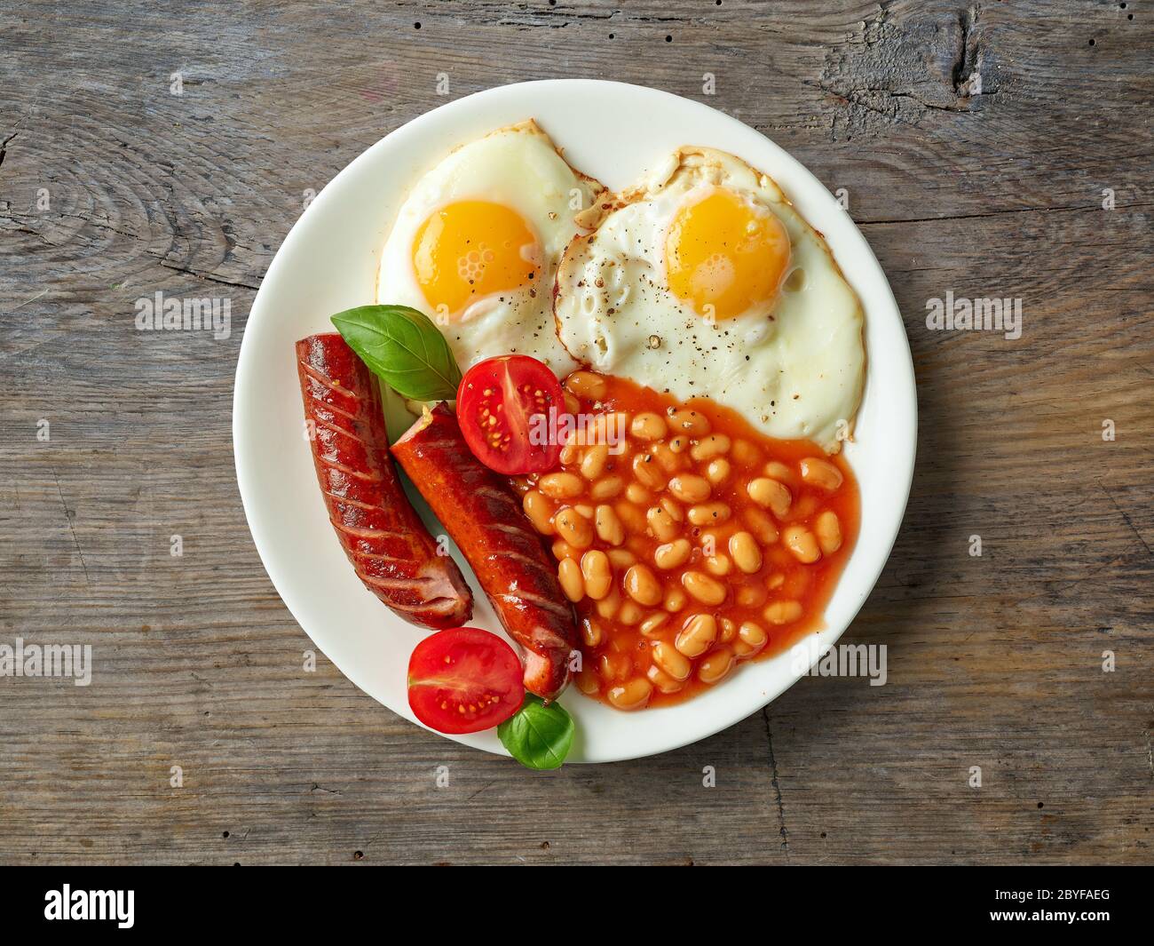 plate of english breakfast on wooden kitchen table, top view Stock ...