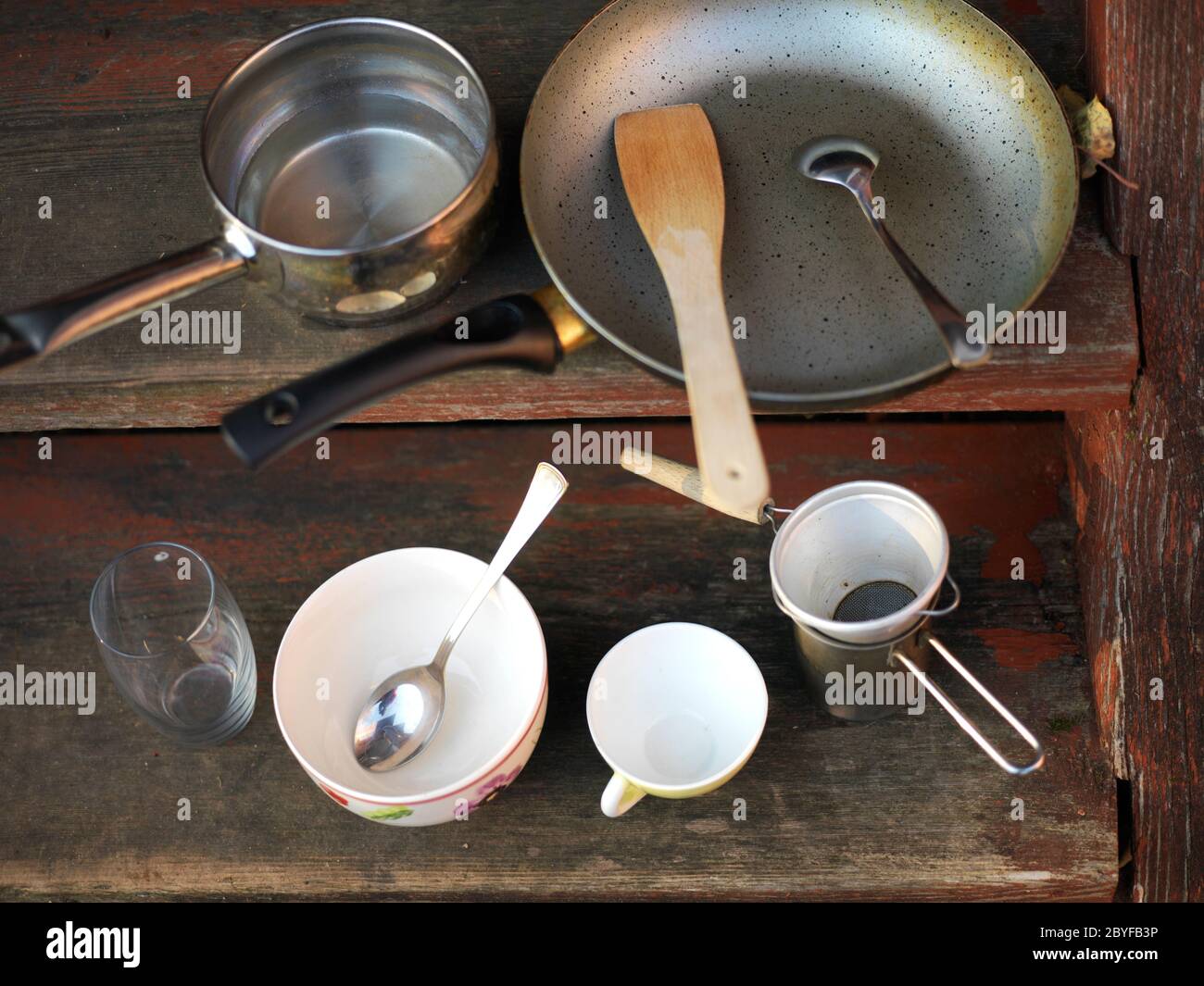 Collection of old kitchenware placed in wooden cupboard Stock Photo - Alamy