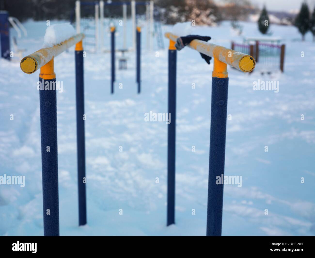 Parallel bars covered with frost, outdoor winter scene Stock Photo - Alamy