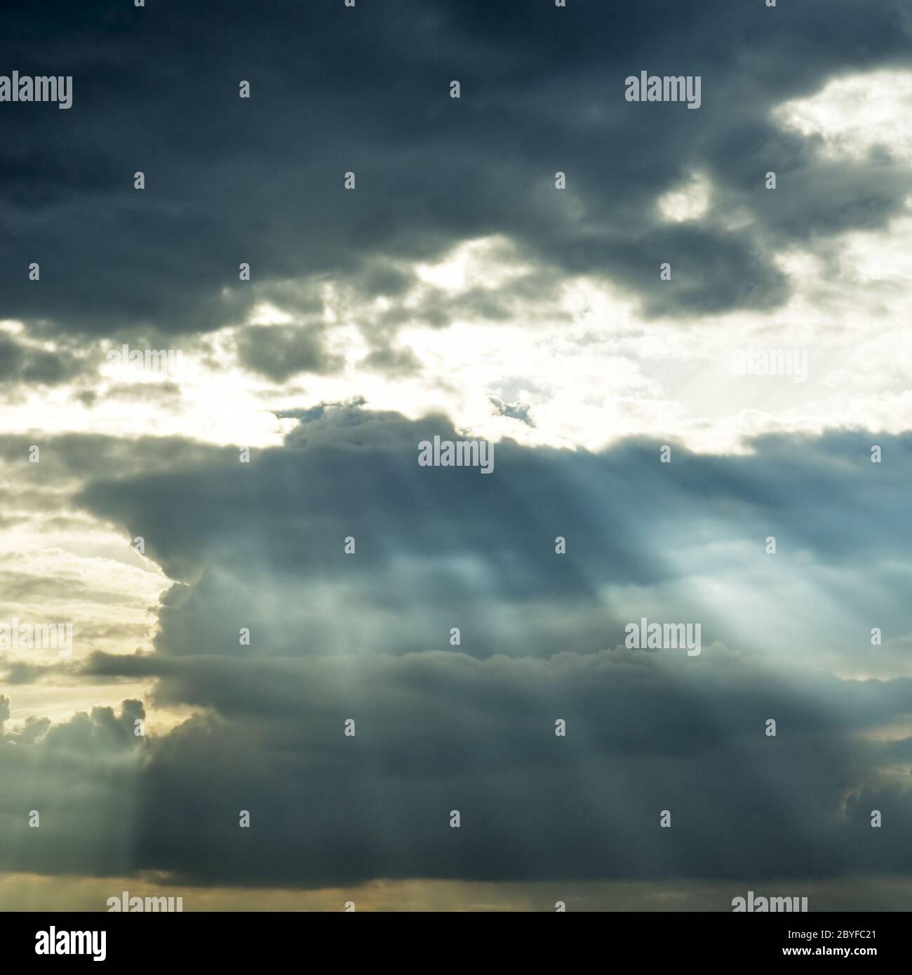 stormy cloud with sun rays Stock Photo - Alamy