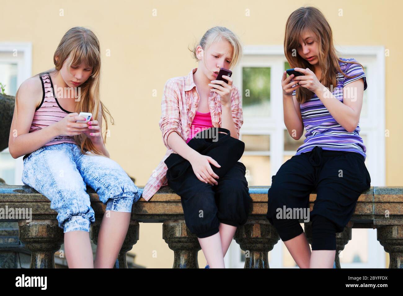 Teenage girls calling on the mobile phones Stock Photo - Alamy