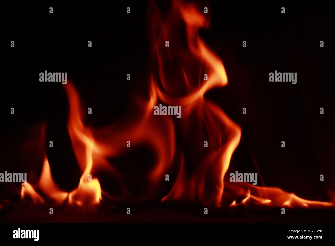 Fire flames with reflection on dark background Stock Photo - Alamy