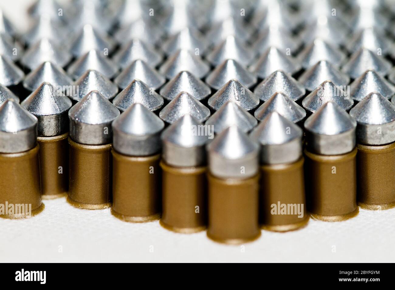 Gun bullets over white background Stock Photo - Alamy