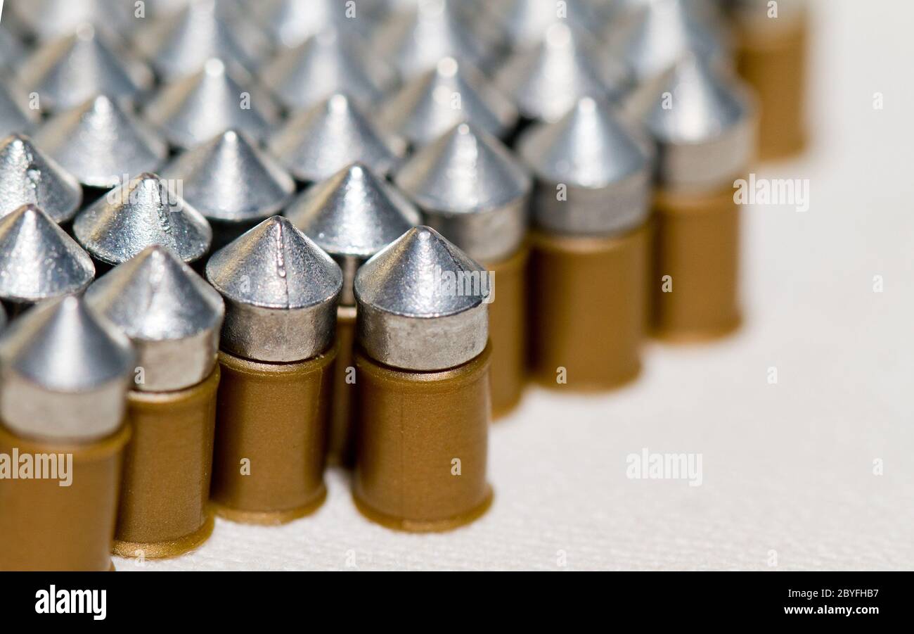 Gun bullets over white background Stock Photo - Alamy