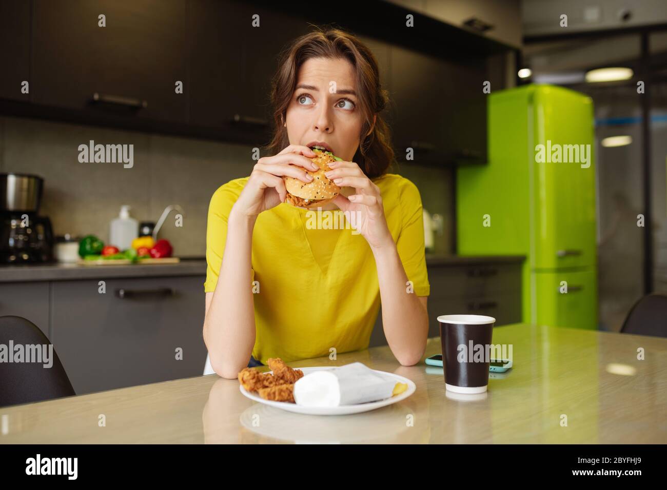 Biting into a burger hi-res stock photography and images - Alamy