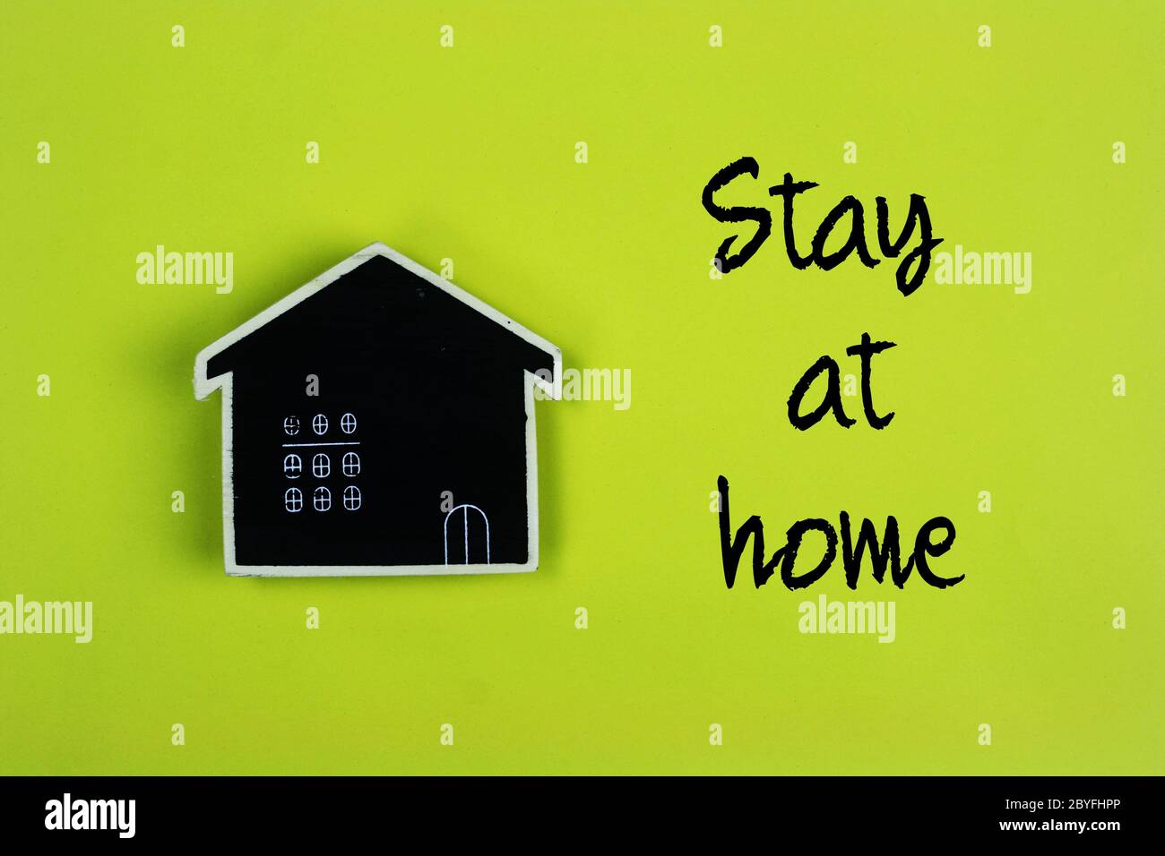 Stay at home concept with green background Stock Photo - Alamy