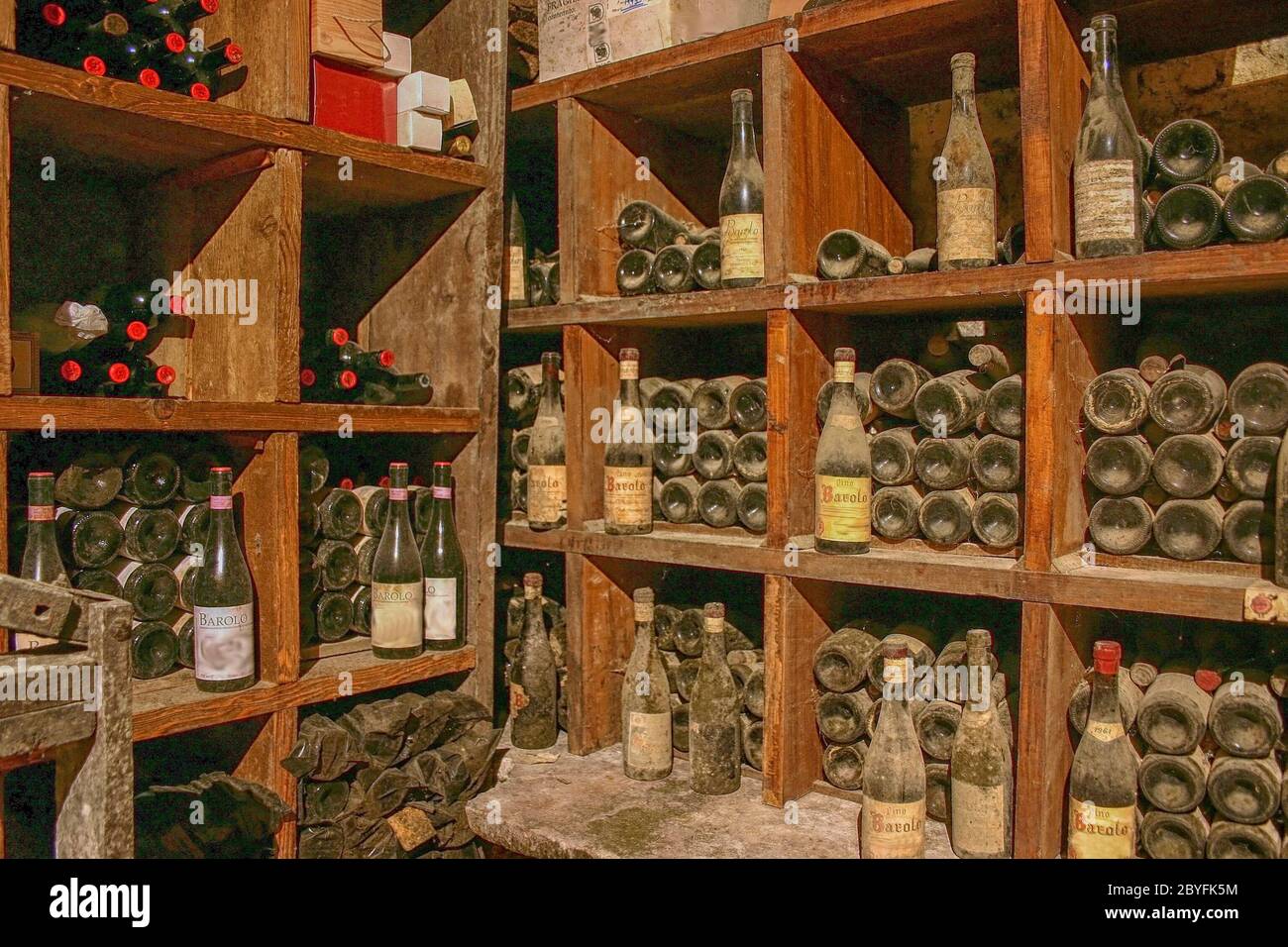 ancient wine bottles gathering dust in italian wine cellar Stock Photo ...