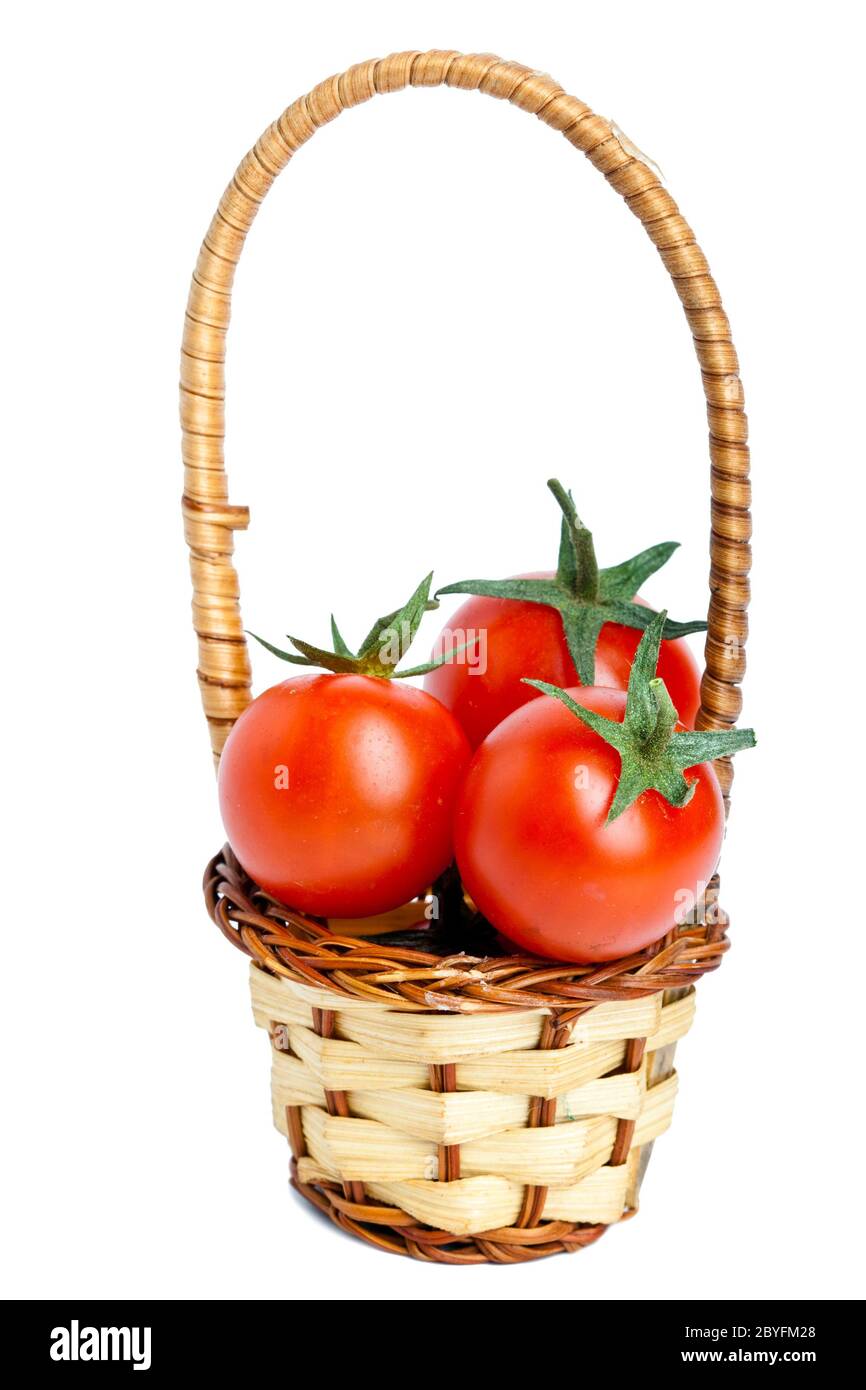 Basket full red tomatoes Cut Out Stock Images & Pictures - Alamy