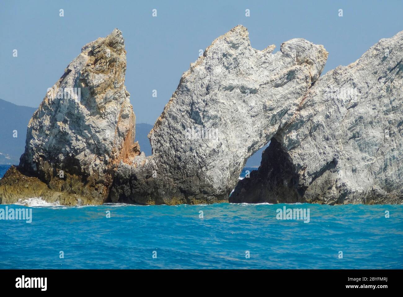 Sunny rock formation around Lalaria beach in Skiathos, one of the greek ...