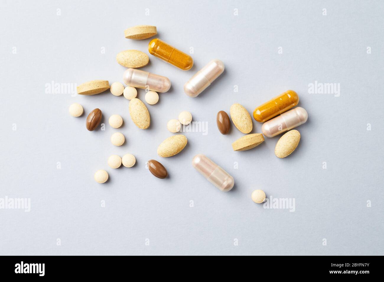Vitamins and supplements on bright paper background. Concept for a ...