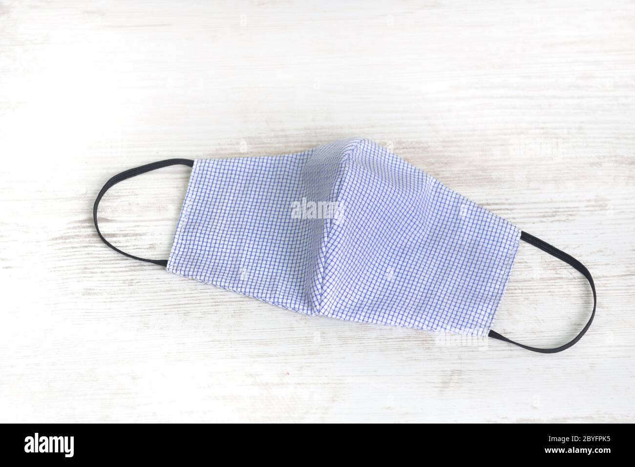 homemade fabric face mask isolated on white desk Stock Photo - Alamy
