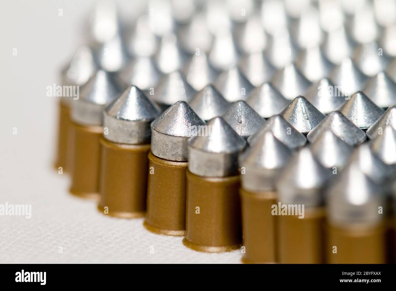 Gun bullets over white background Stock Photo - Alamy