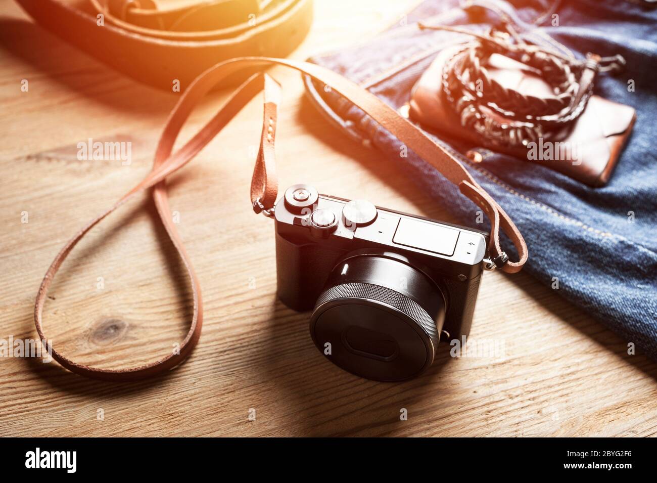 vintage style of digital mirrorless camera with leather strap with men ...