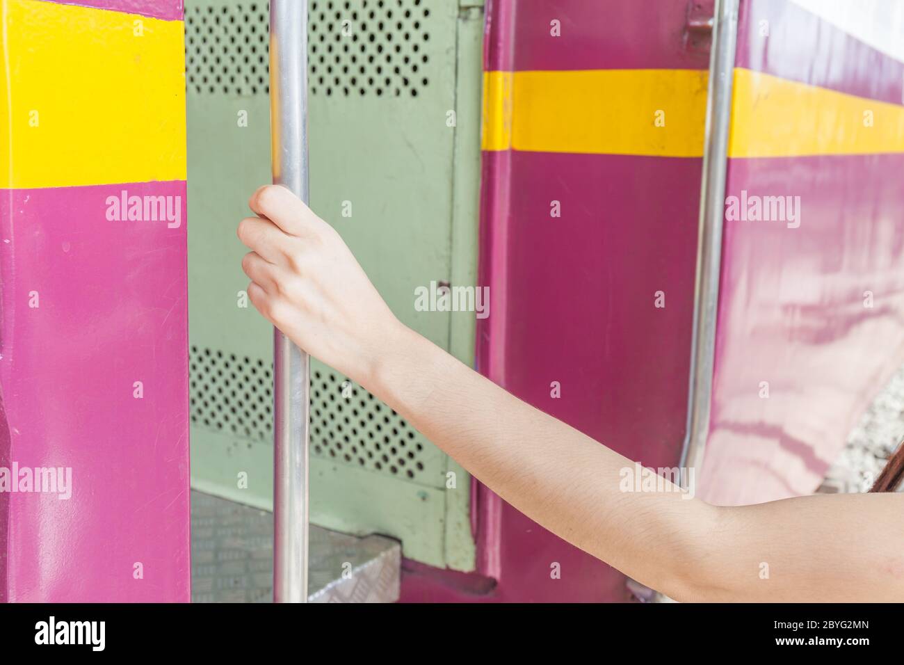 Holding the rail hi-res stock photography and images - Alamy