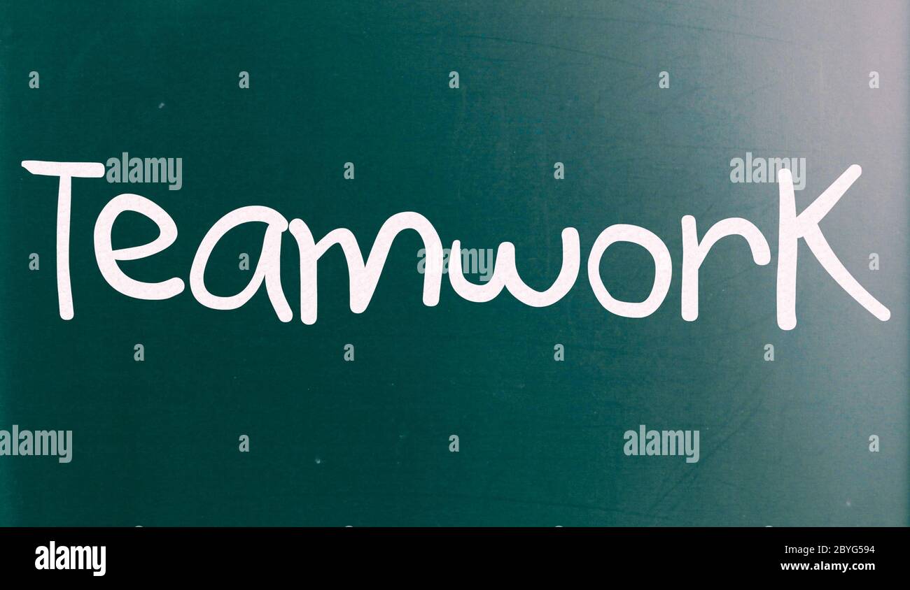 The word Teamwork handwritten with white chalk on a blackboard Stock ...