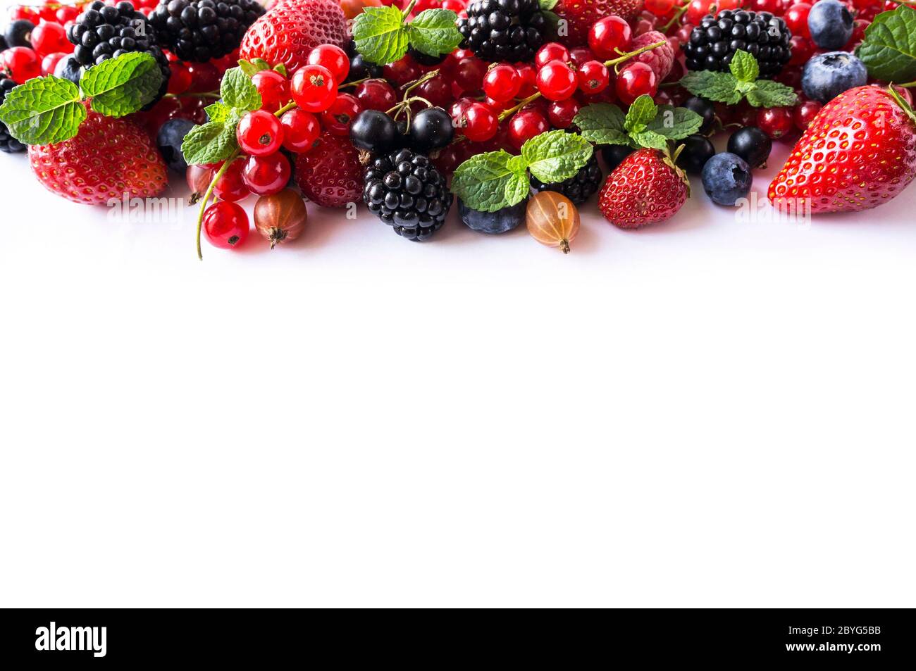 Mix berries on a white background. Ripe red currants, strawberries ...